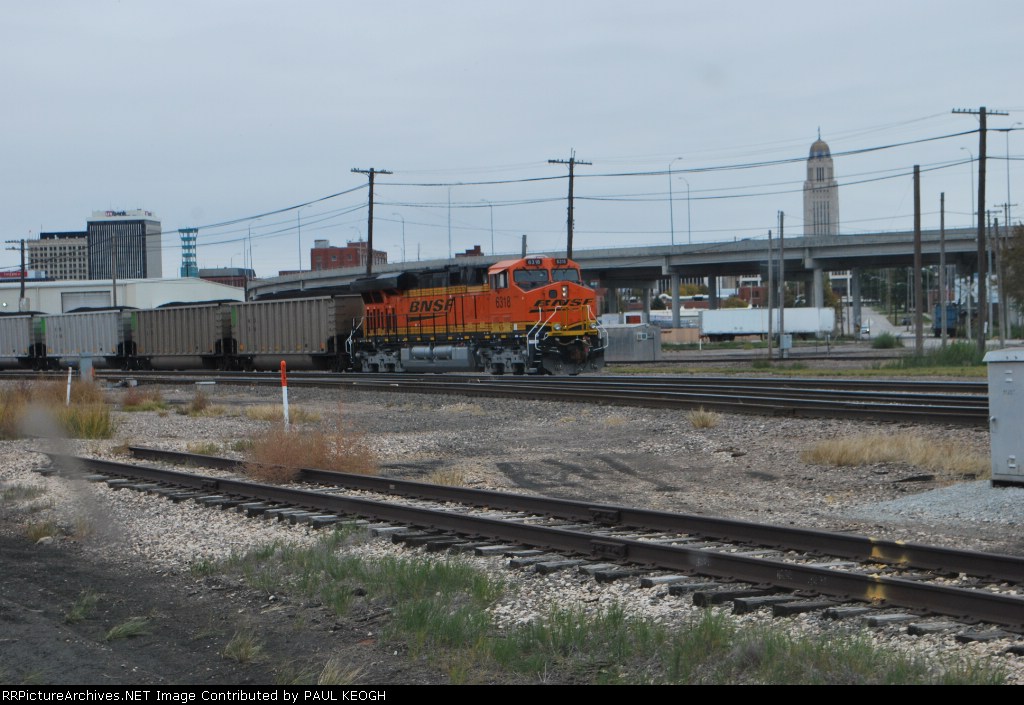With Capitol rotunda in the background BNSF 6318 pushes a loaded coal train east towards Creston ...